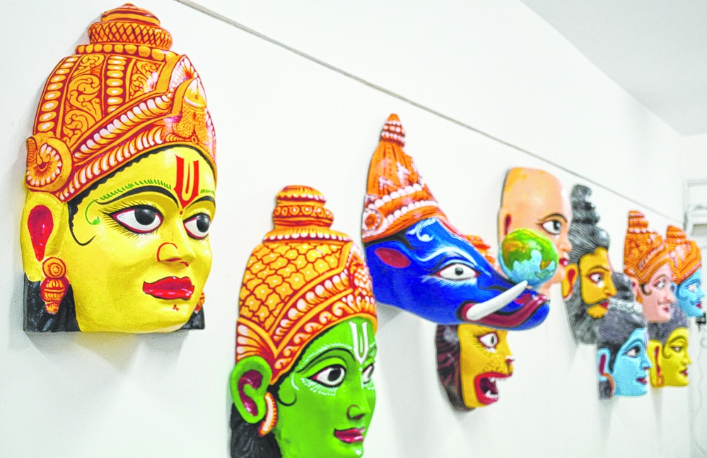 Artists carve masks out of paper waste - Telegraph India
